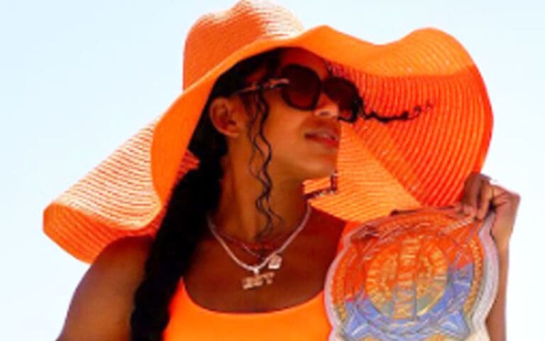 Bianca Belair Basks In Saudi Arabian Sun With Orange Swimsuit Snap