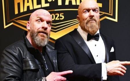 Triple H Poses with His Wild-Eyed Wax Statue at WWE World